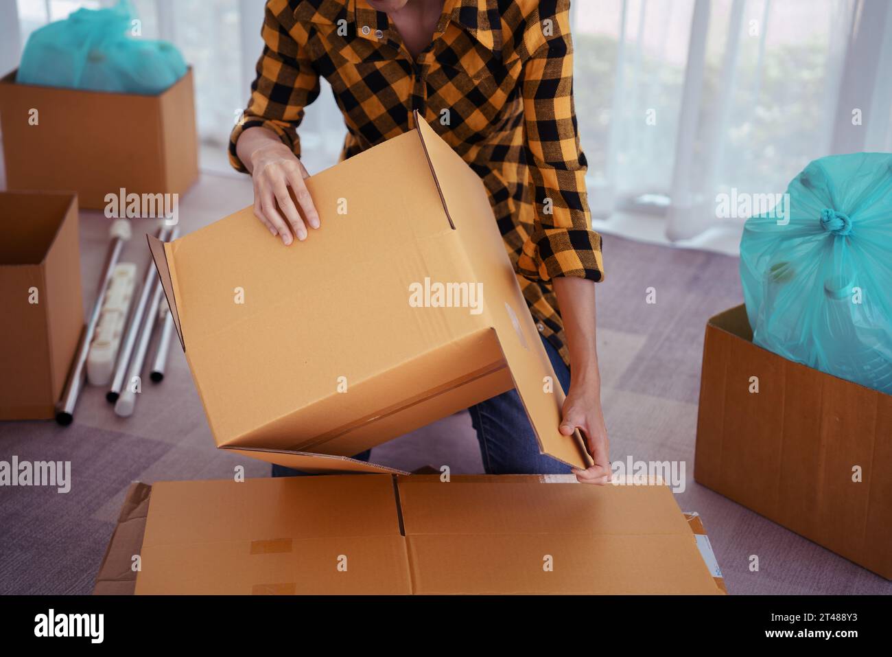 Women picking and sorting waste cardboard box to reuse and recycling ...
