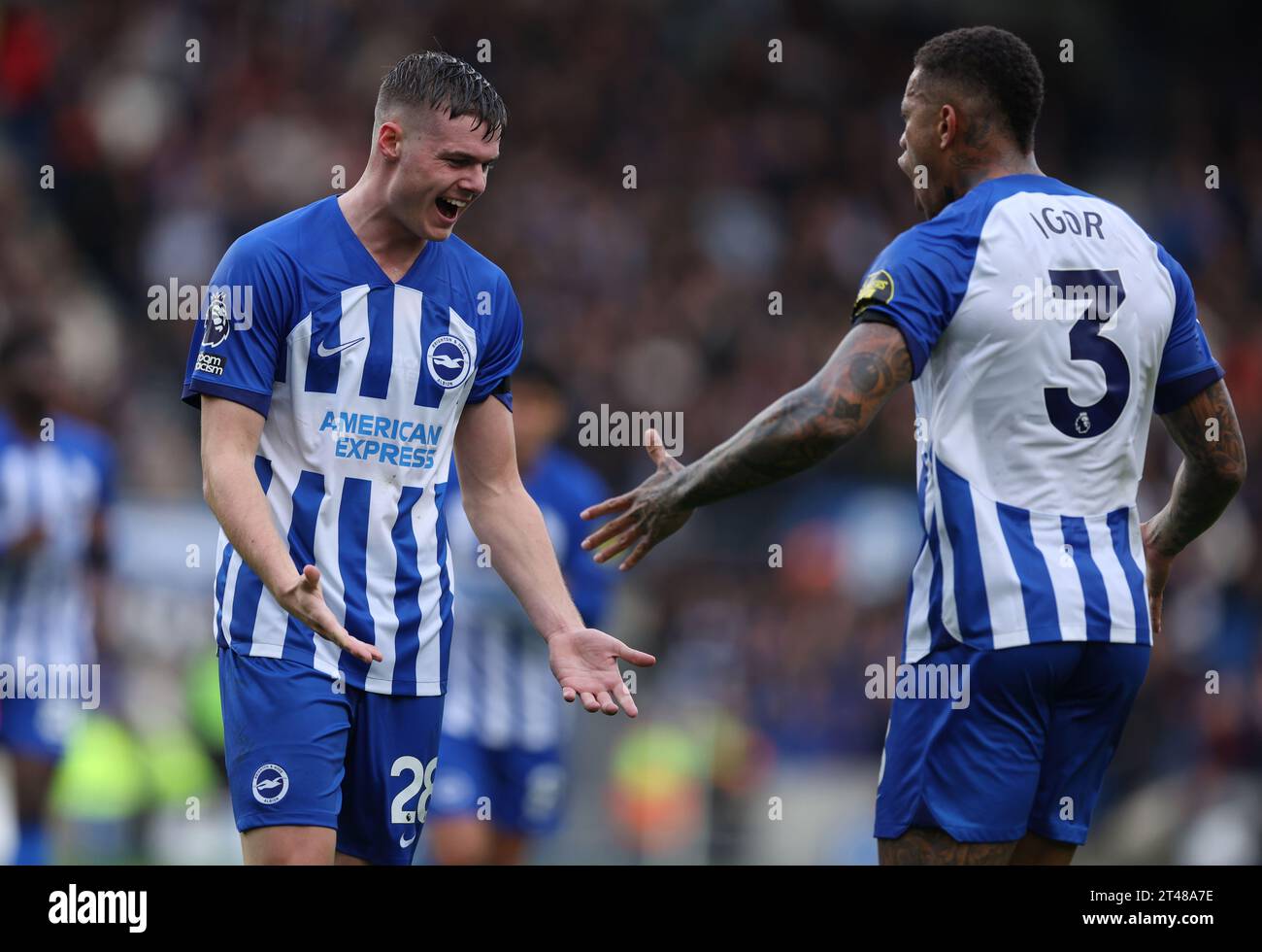 Brighton and Hove Albion's Evan Ferguson (left) celebrates scoring the ...