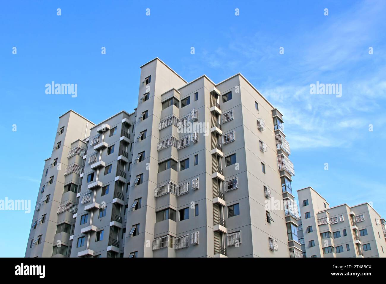 high rise buildings in the blue sky, closeup of photo Stock Photo - Alamy