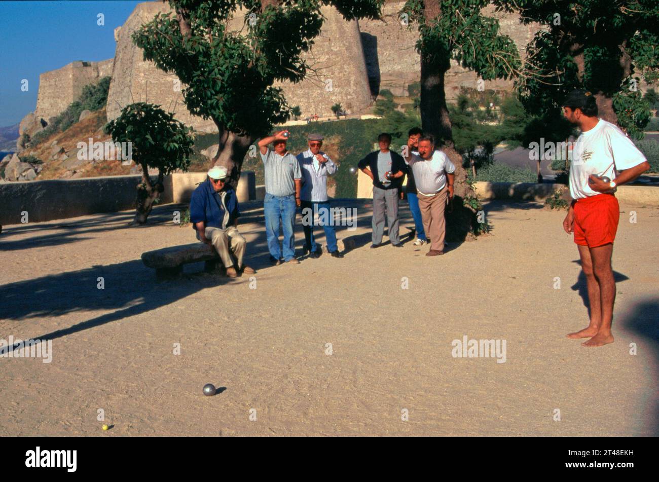 Group of men playing boules in Calvi, Corsica, France Stock Photo - Alamy