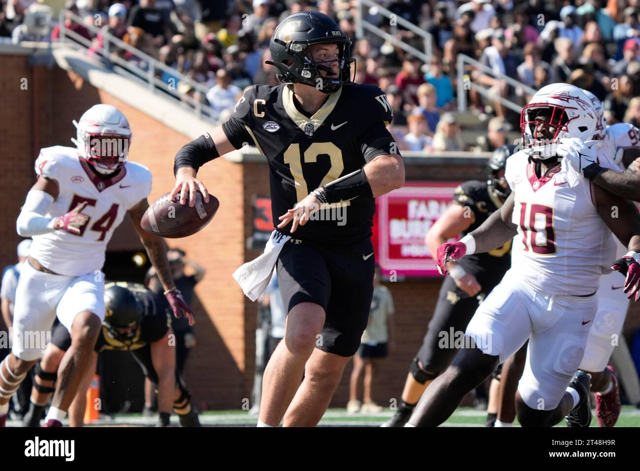 Wake Forest quarterback Mitch Griffis (12) looks to pass against ...
