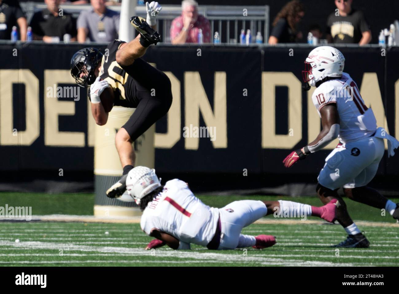 Wake Forest running back Tate Carney (30) hurdles Florida State ...
