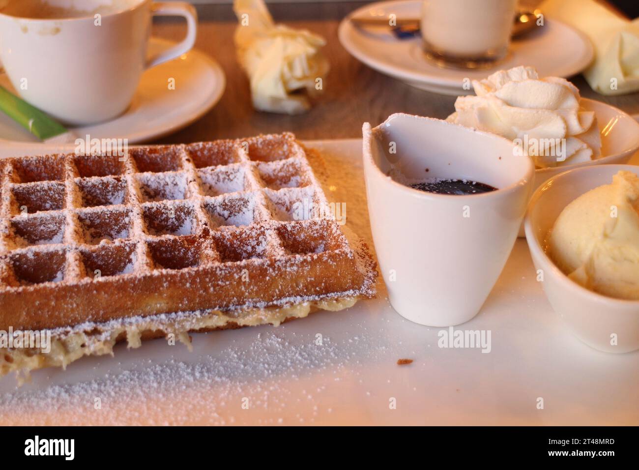 Brussels-style waffles at a cafe in Bruges, Belgium Stock Photo - Alamy
