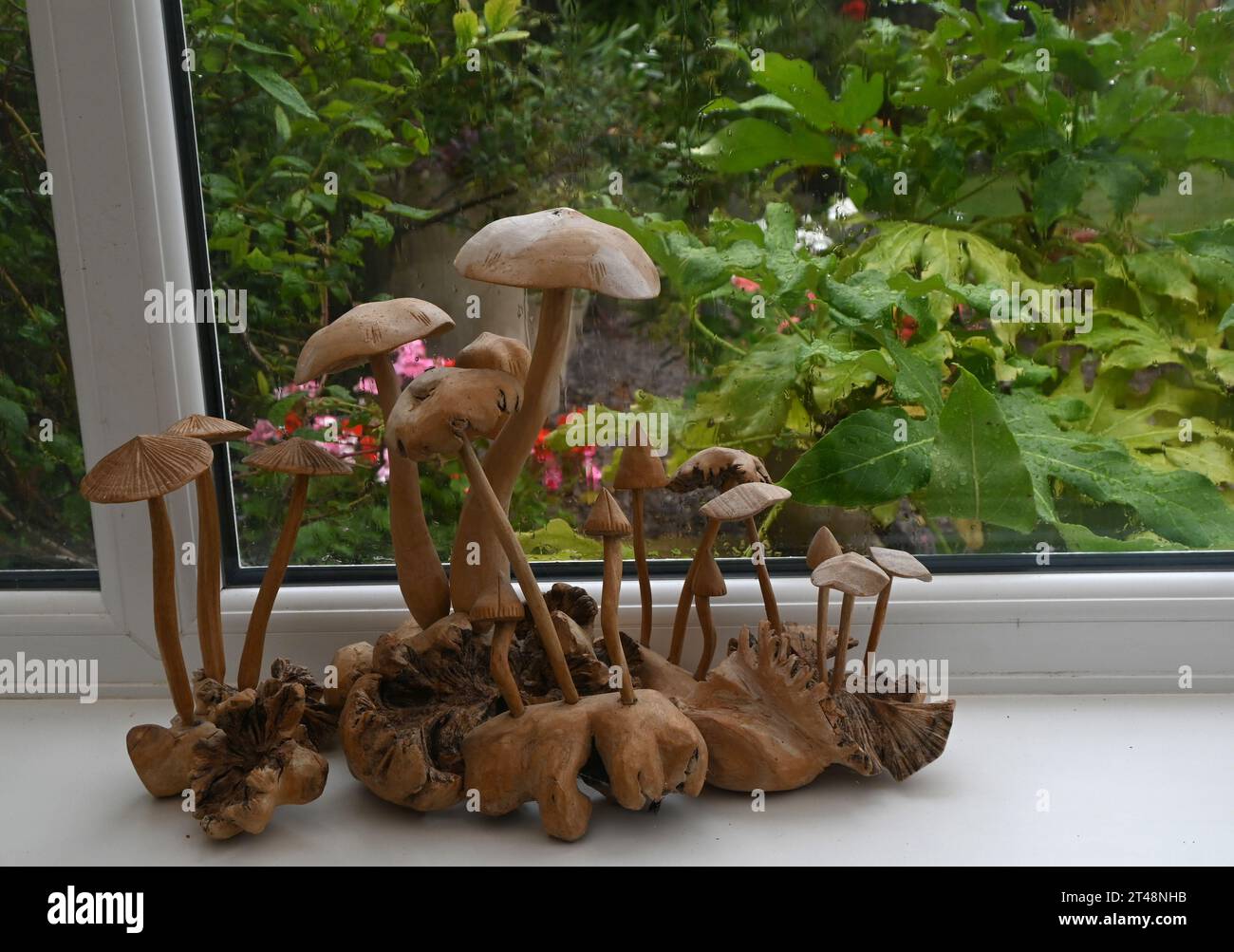 decorative carving of wooden funghi Stock Photo - Alamy