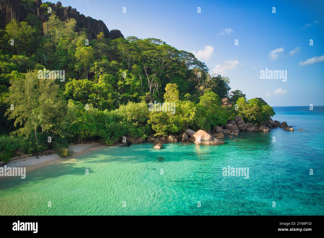 Drone bird eye view at Anse solei beach, bridge over river within ...