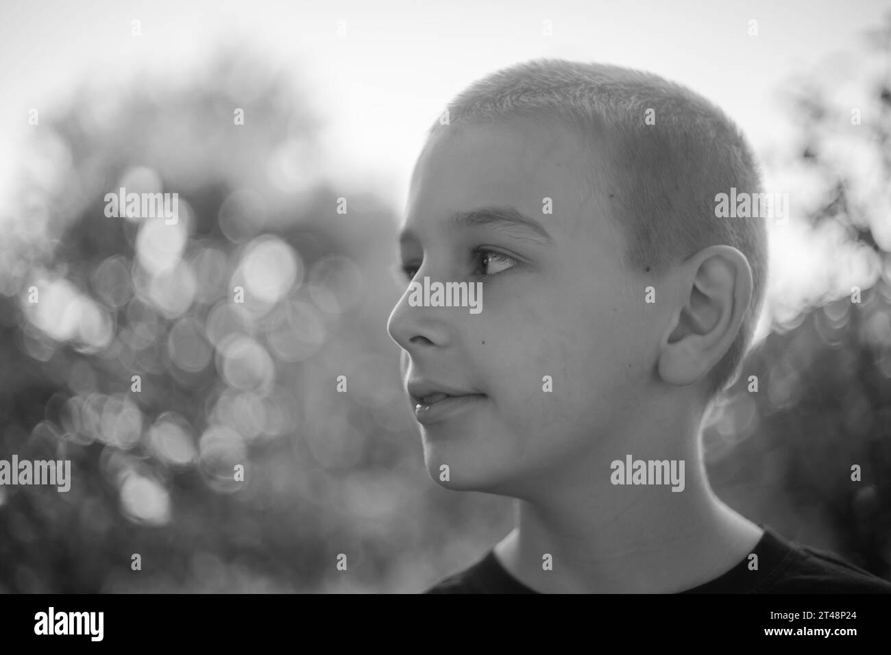 Cute little curious boy in green nature waiting for magic. Inquisitive ...