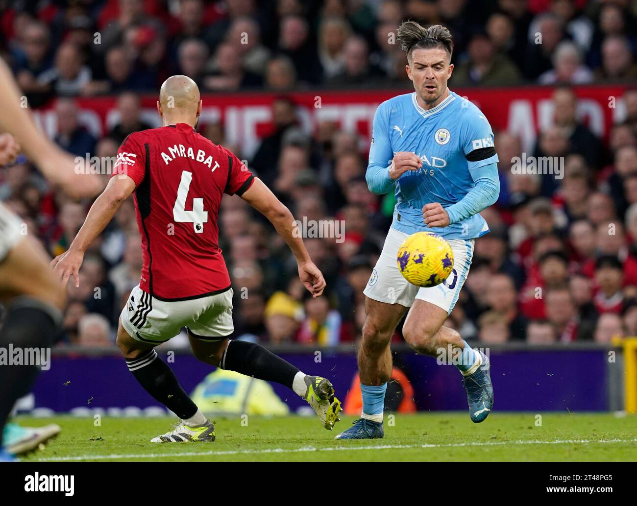 Manchester, UK. 29th Oct, 2023. Jack Grealish of Manchester City tussles with Sofyan Amrabat of ...