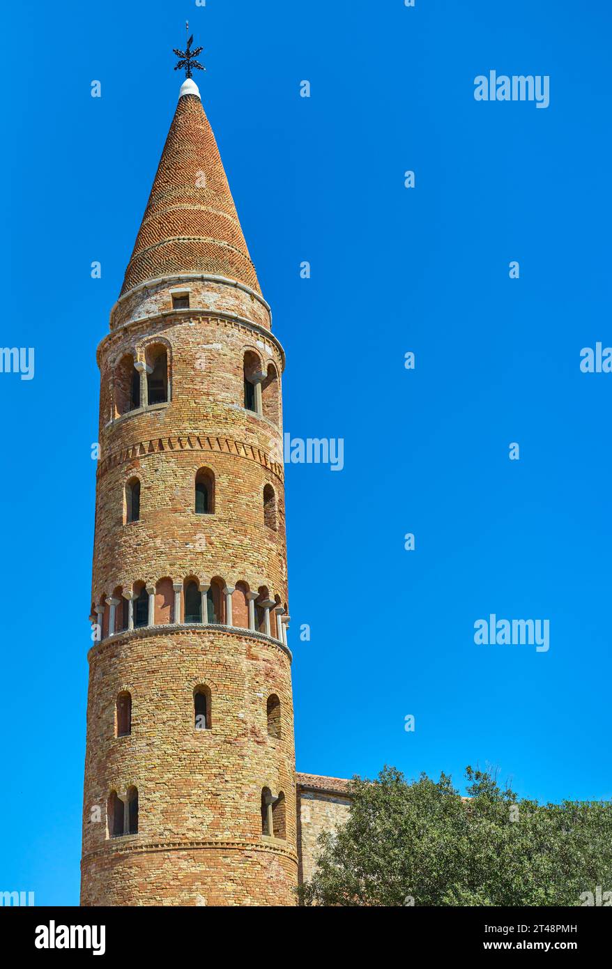 Caorle, Italy, the cylindrical bell tower of the Romanesque style ...