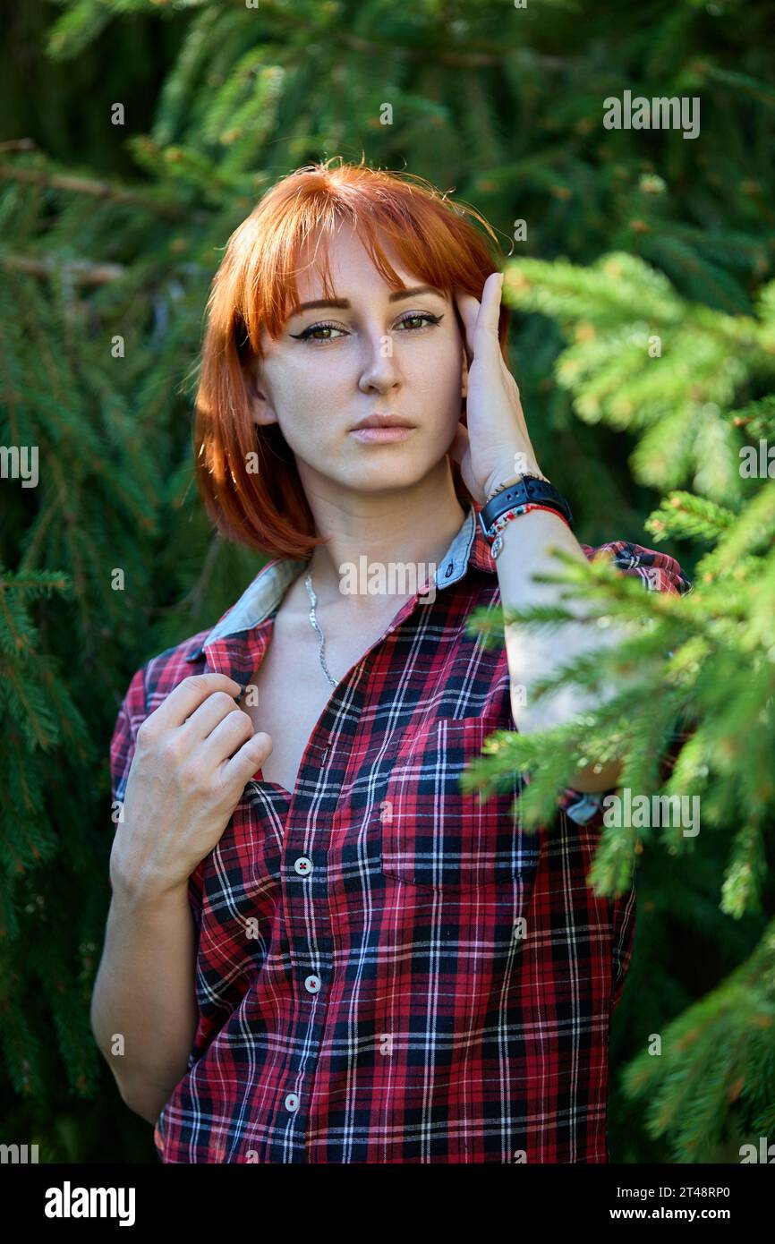 A Redhead Woman Poses Gracefully In The Warm Glow Of An Autumn Sunset a-redhead-woman-poses-gracefully-in-the-warm-glow-of-an-autumn-sunset