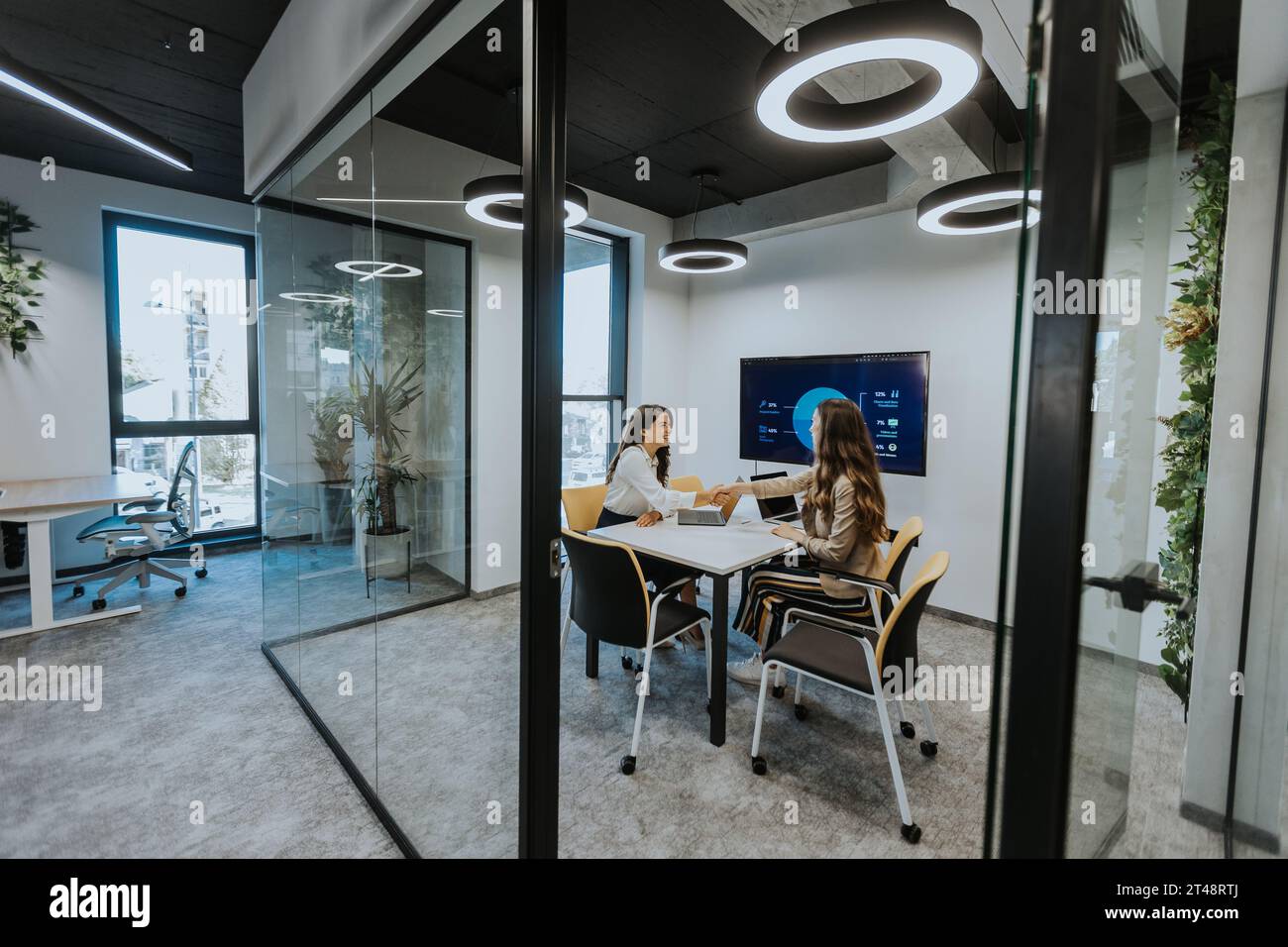 Young business women discussing in cubicle at the modern office Stock ...