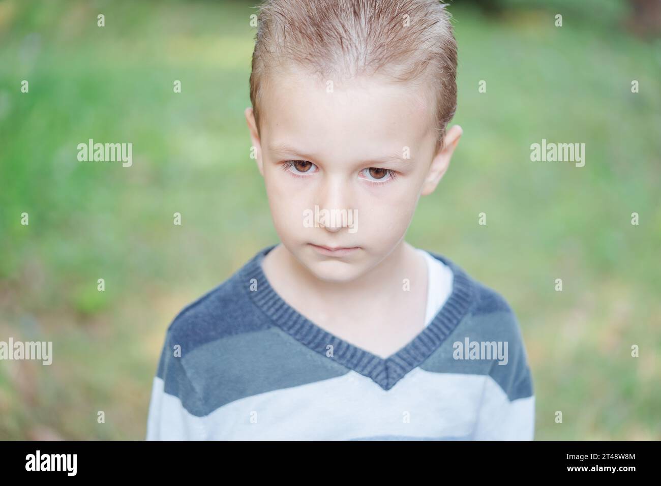 Cute little curious boy in green nature waiting for magic. Inquisitive ...