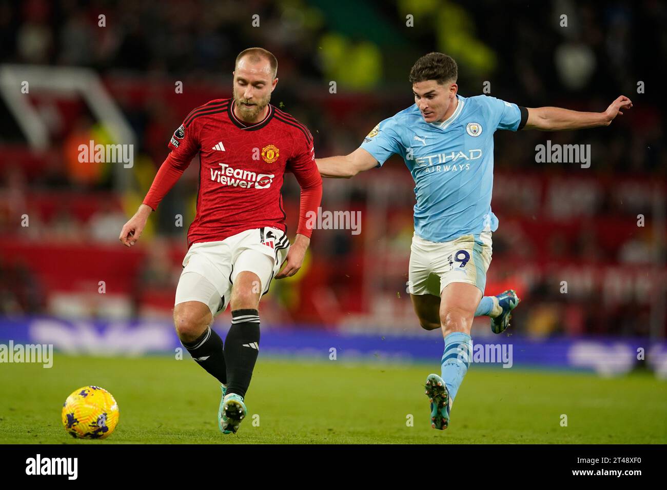 Manchester United's Christian Eriksen, left, is challenged by ...