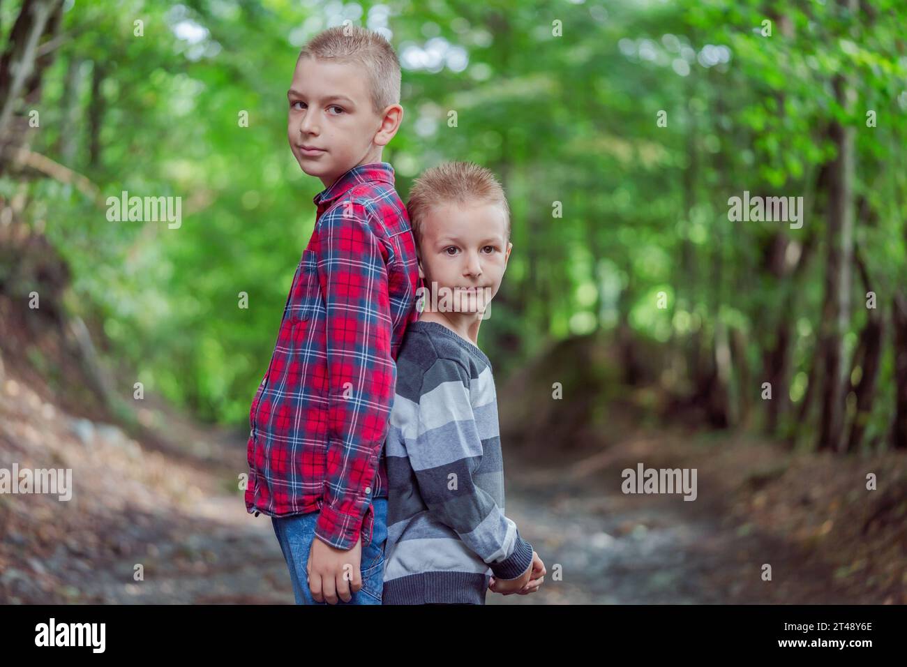 Cute little curious boy in green nature waiting for magic. Inquisitive ...
