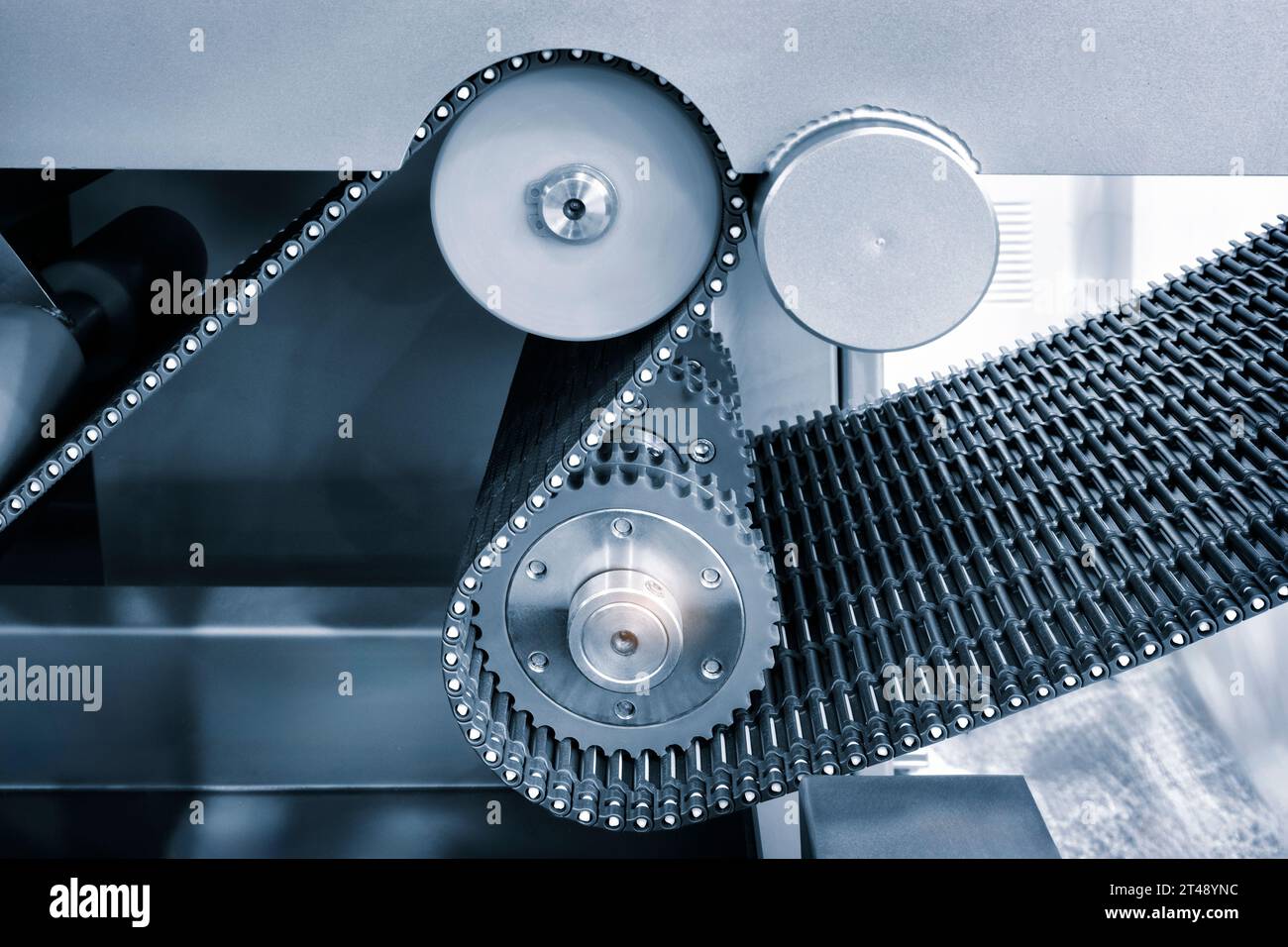 Gear chain drive shaft in conveyor belt is on production line. Timing ...