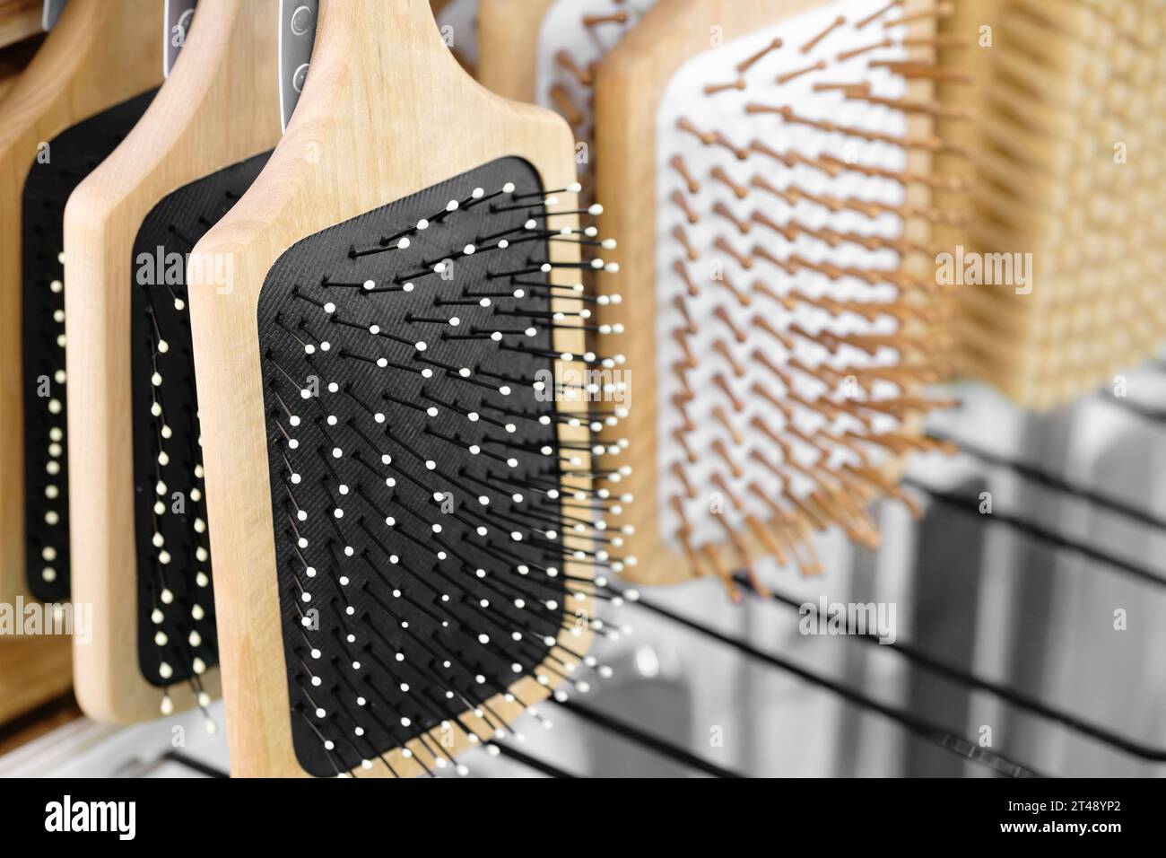 Massage combs hang on a display window in a market, close-up Stock ...