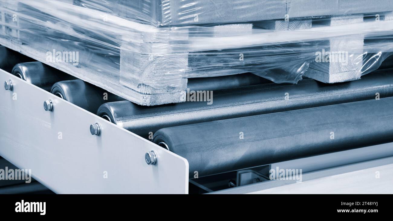 Cardboard boxes on a pallet wrapped in plastic wrap ready for delivery ...