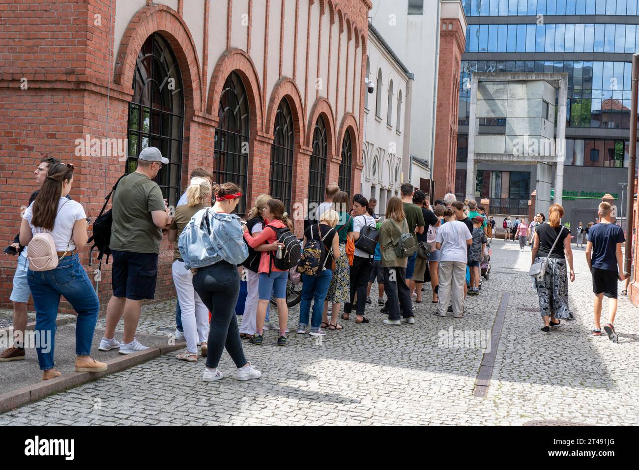 Warsaw, Poland - August 1, 2023. Lots of people are queuing outside to ...