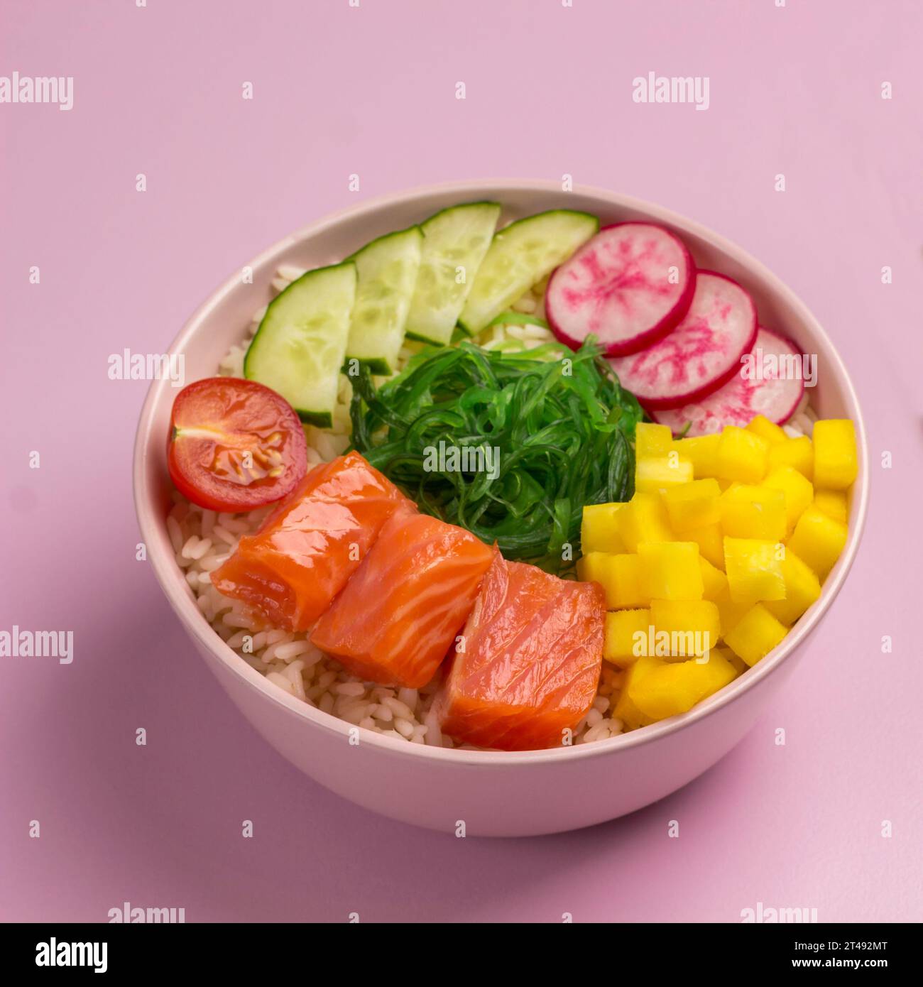 Traditiona Hawaiian red fish poke bowl with rice, radish,cucumber ...