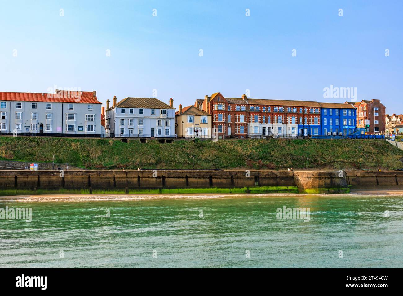 A mixture of colourful architecture on the seafront above the pier in ...