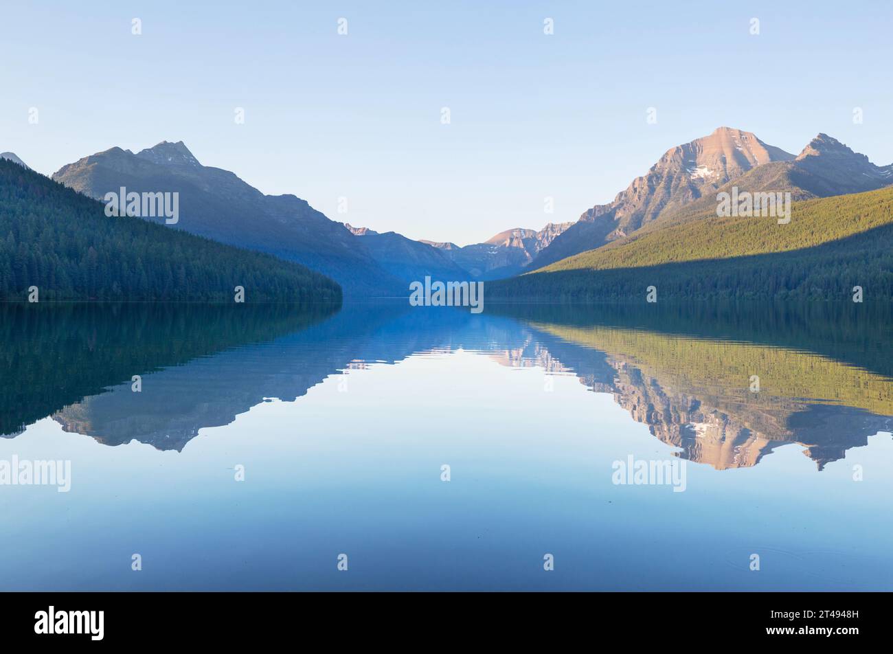 Beautiful Bowman lake with reflection of the spectacular mountains in ...
