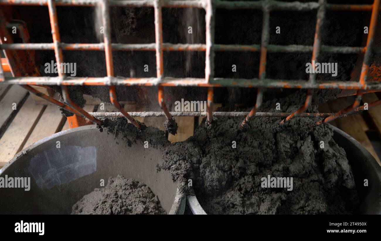 The process of pouring a foundation manually. The solution is poured ...