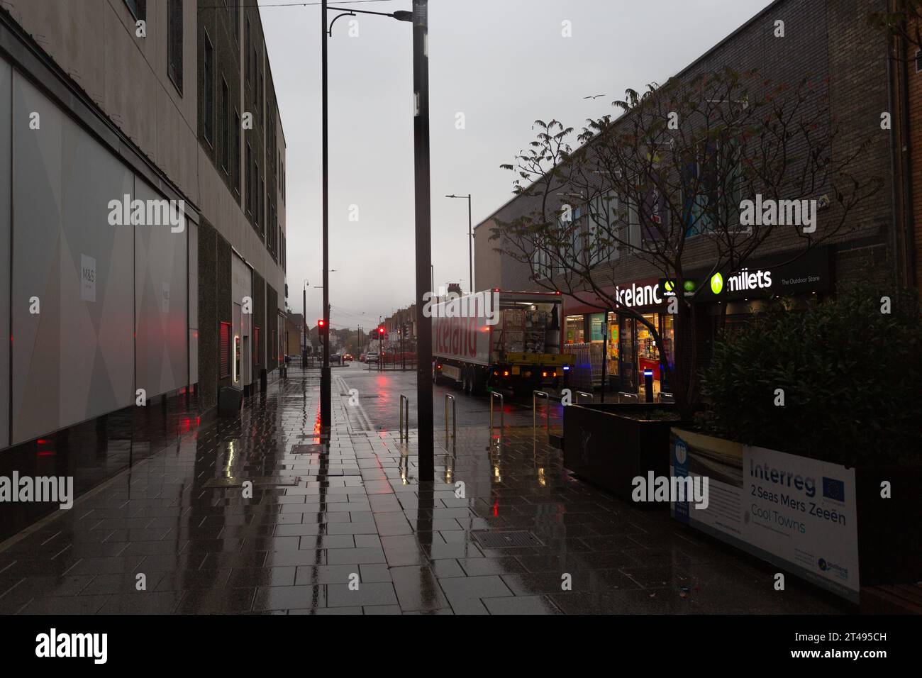 Business / Supply Chain - Stocking up - Lorry driver unloading goods on ...