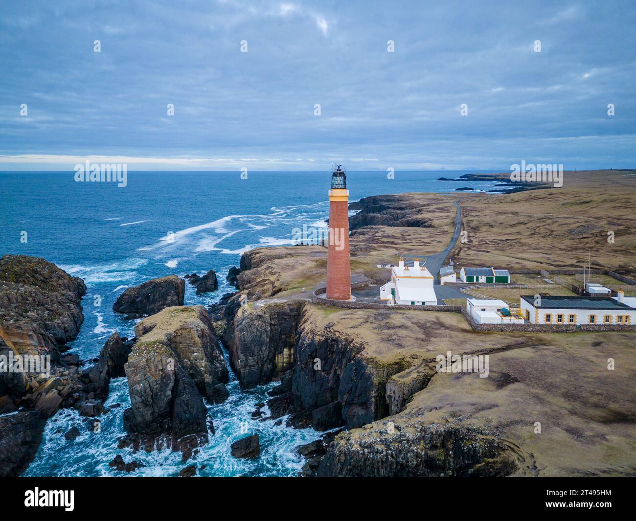 Aerial view of sunset and lilac sky over Butt of Lewis Lighthouse in ...