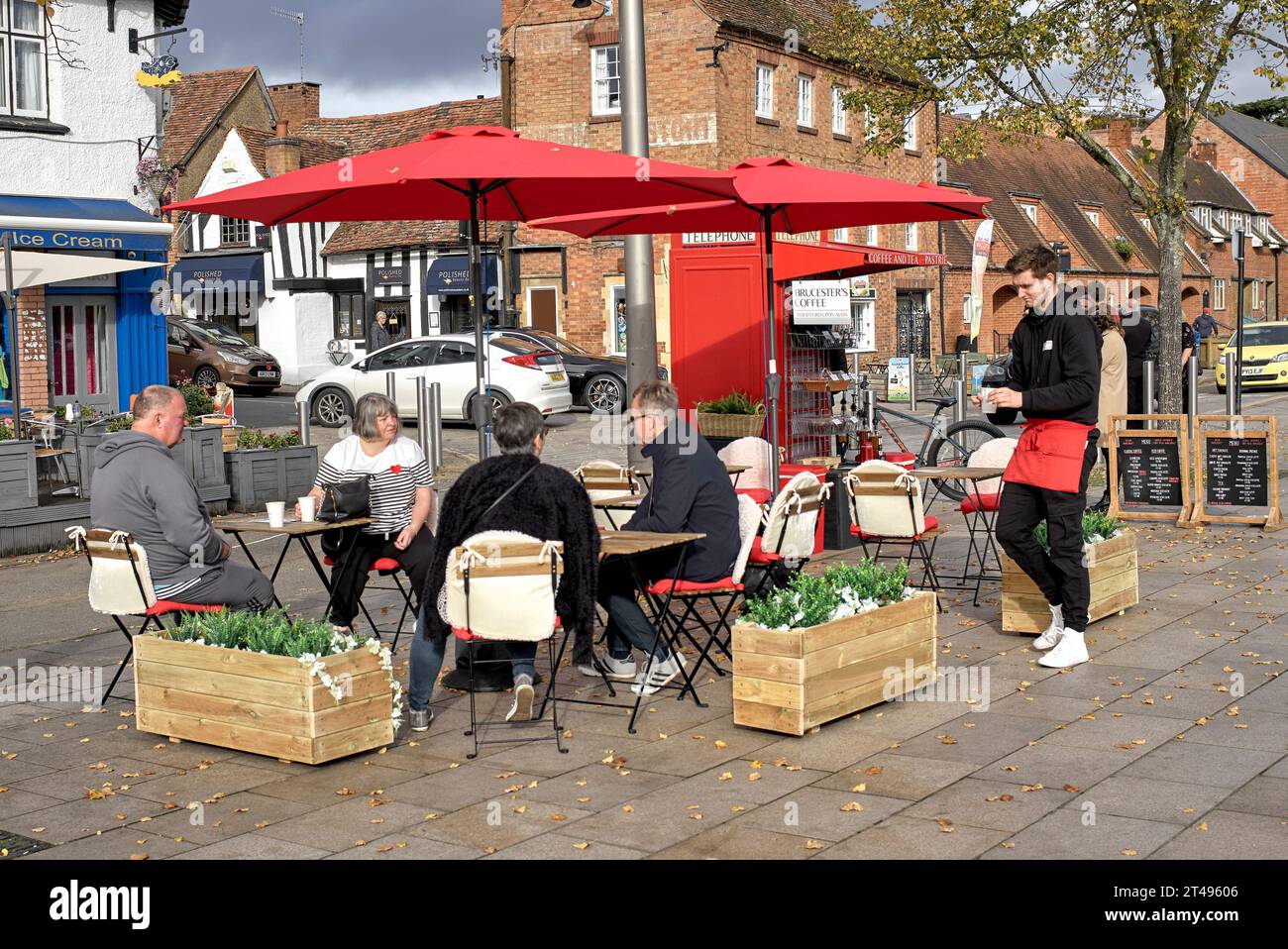 Pavement coffee shop from an converted telephone kiosk with customers ...