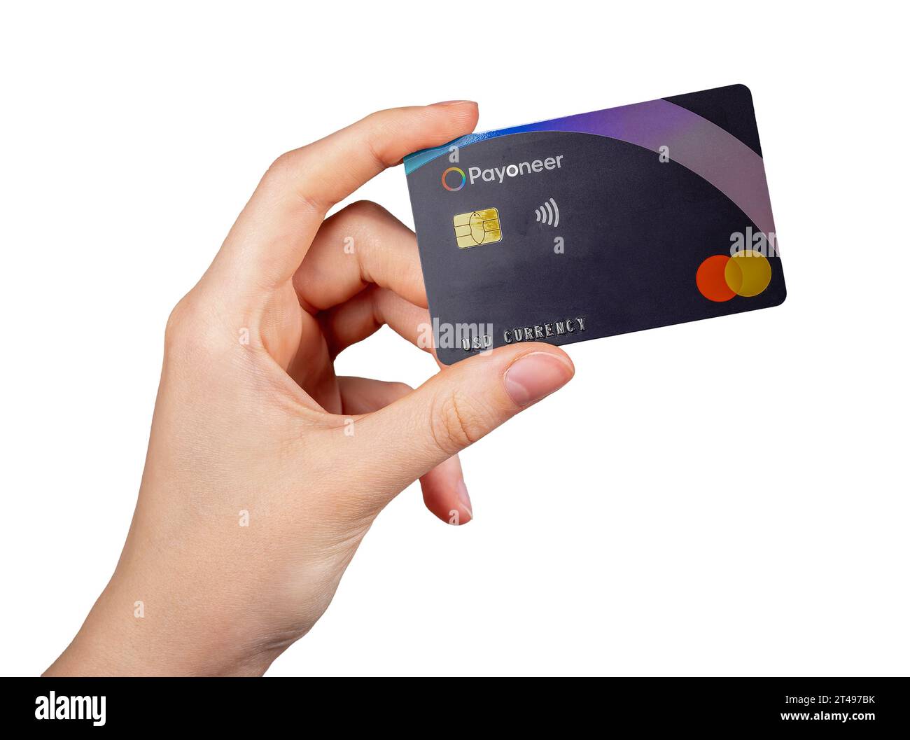 Berlin, Germany October 20 2023 Hand holding Payoneer plastic card ...
