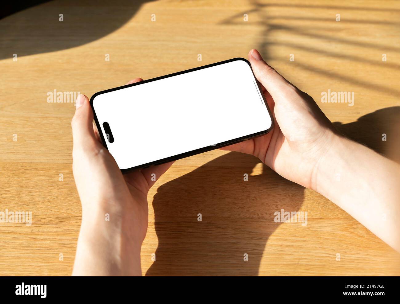 Hands hold smartphone horizontally hi-res stock photography and images ...