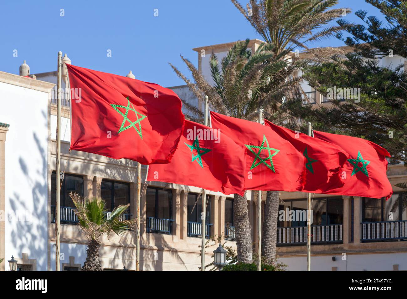 Five Moroccan flags waving atop of their poles Stock Photo - Alamy