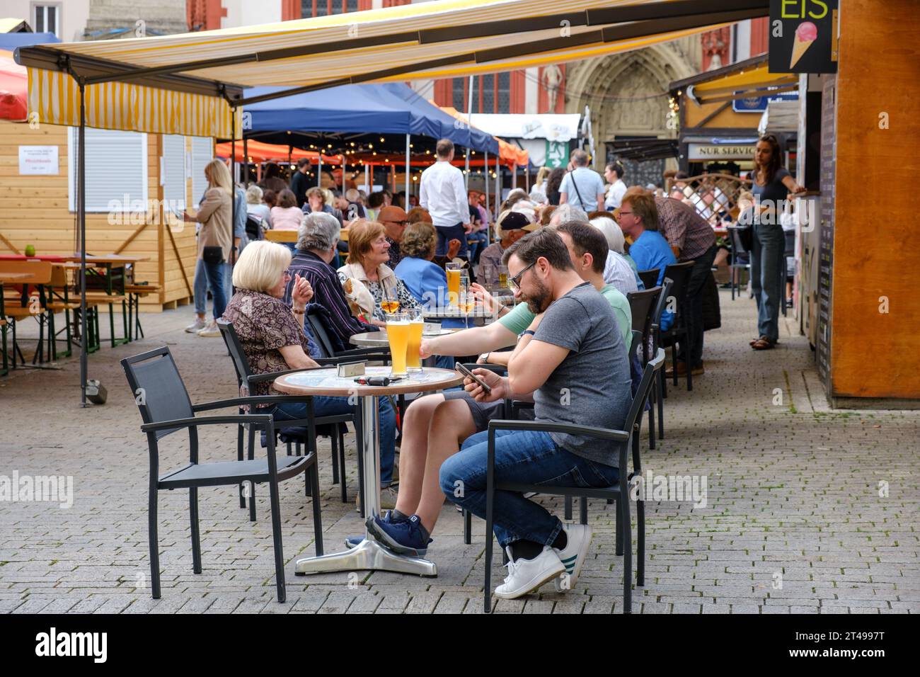 View of different visitors at the Weindorf wine festival in the German ...