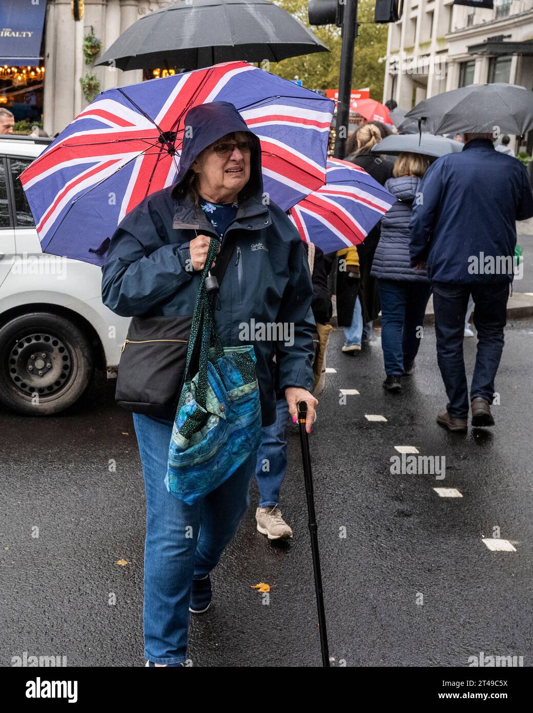London, UK. 29 October 2023. UK Weather - Tourists with Union Jack ...