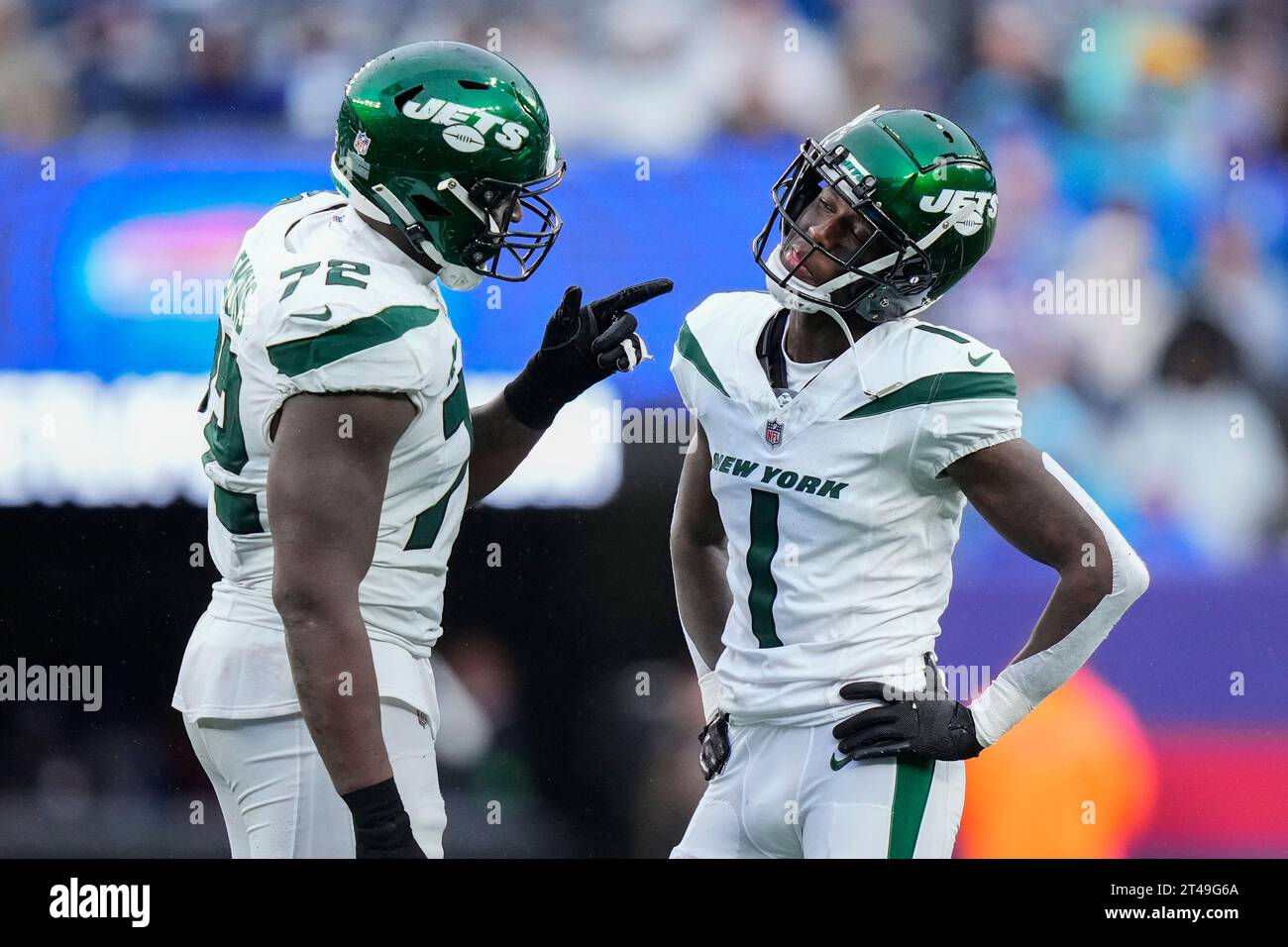 New York Jets defensive lineman Micheal Clemons (72) and cornerback ...