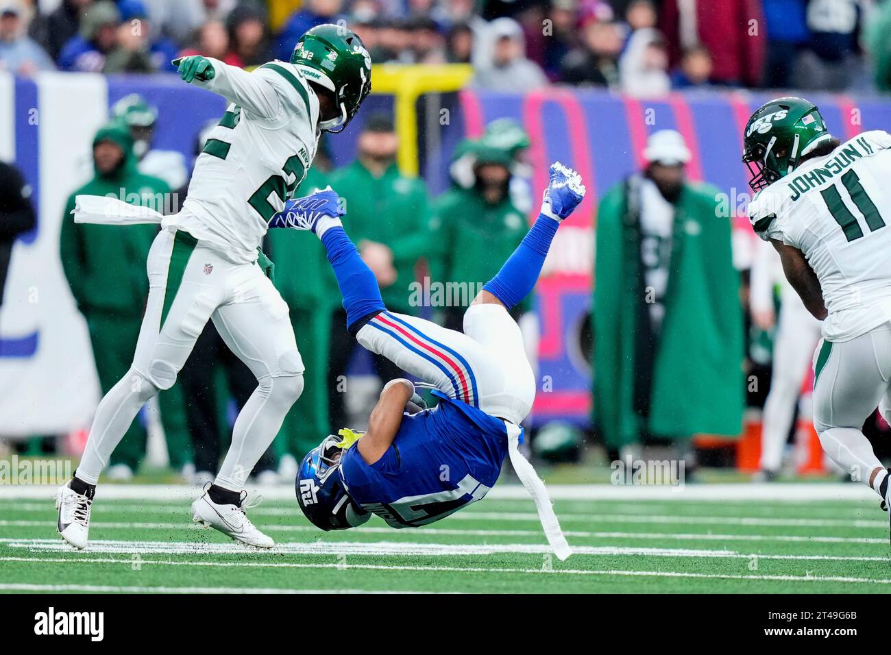 New York Jets safety Tony Adams (22) tackles New York Giants wide ...