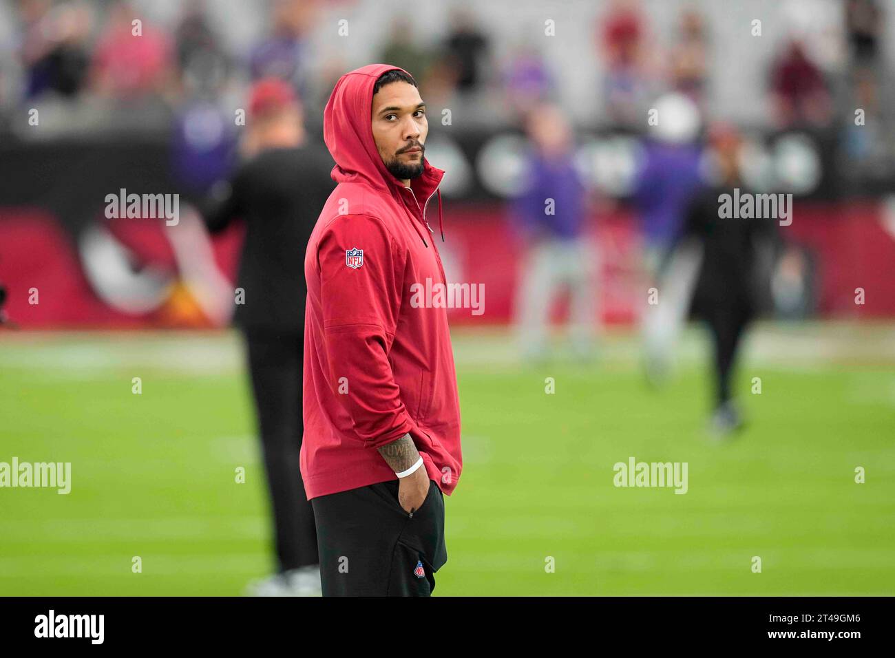 Arizona Cardinals injured running back James Conner stands on the field ...