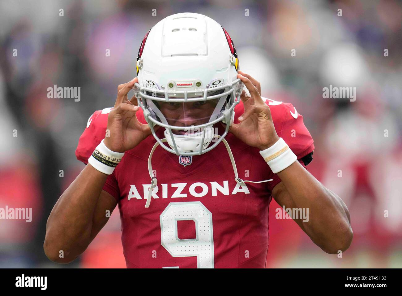 Arizona Cardinals quarterback Joshua Dobbs adjusts his helmet during ...
