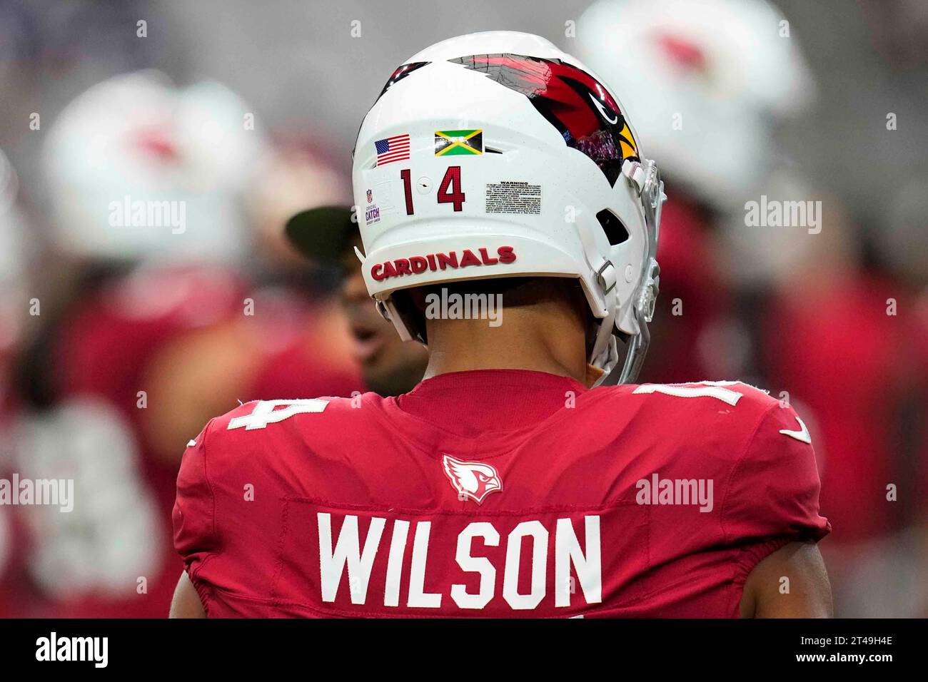 Arizona Cardinals wide receiver Michael Wilson wears a helmet with flag ...