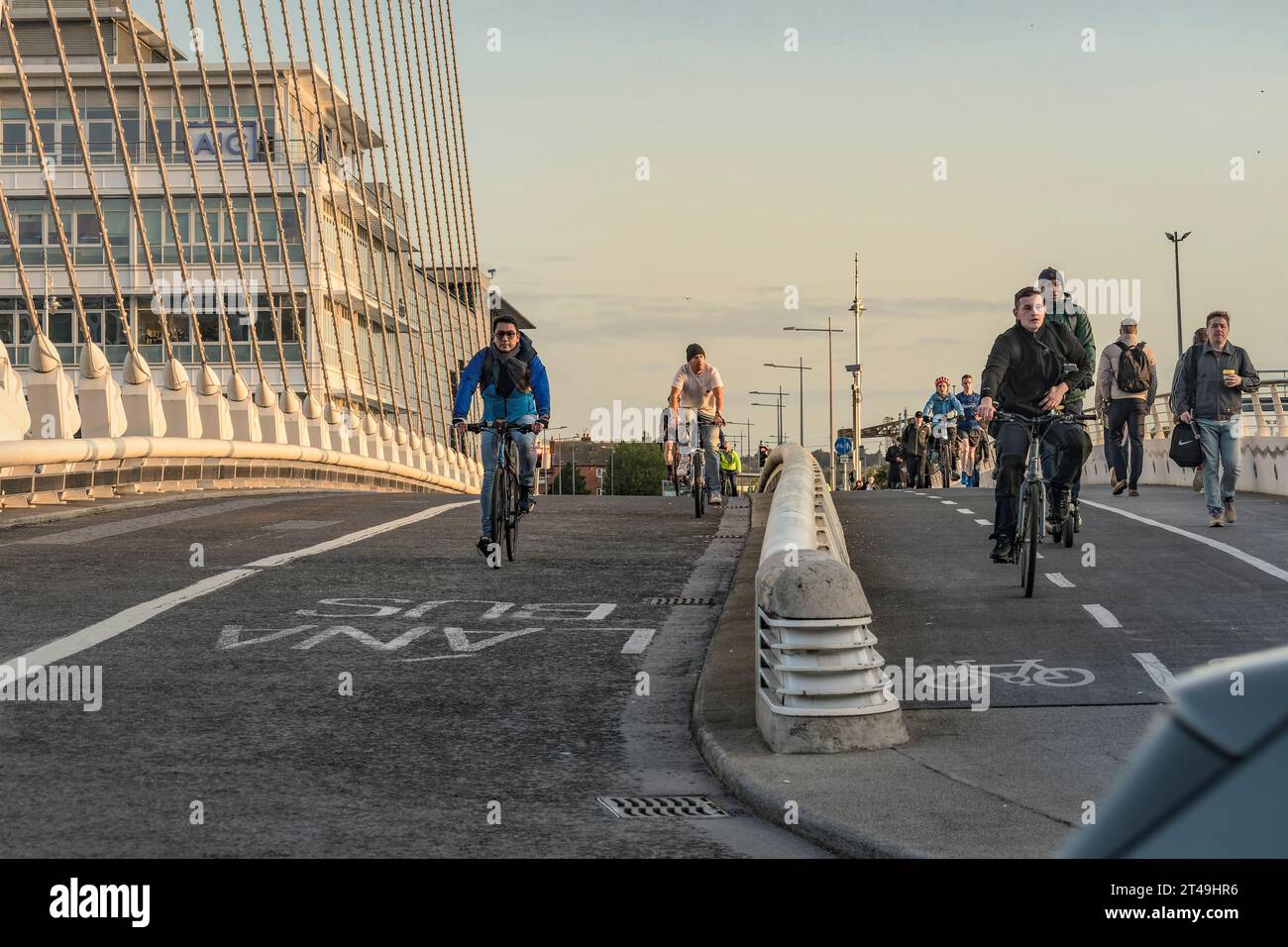Cycling to work. Cyclists crossing Liffey River by Samuel Beckett ...