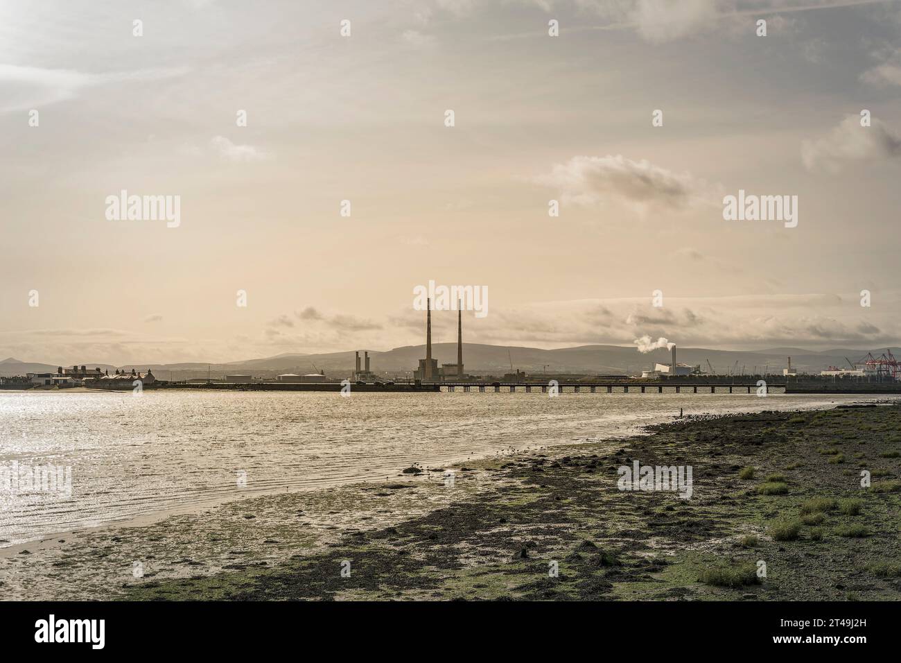 Dublin Bay and twin chimneys in the misty morning as seen from Clontarf ...