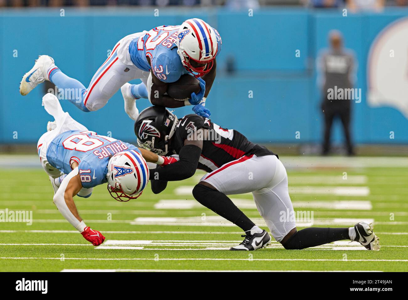 Tennessee Titans running back Tyjae Spears (32) goes airborne as he's ...