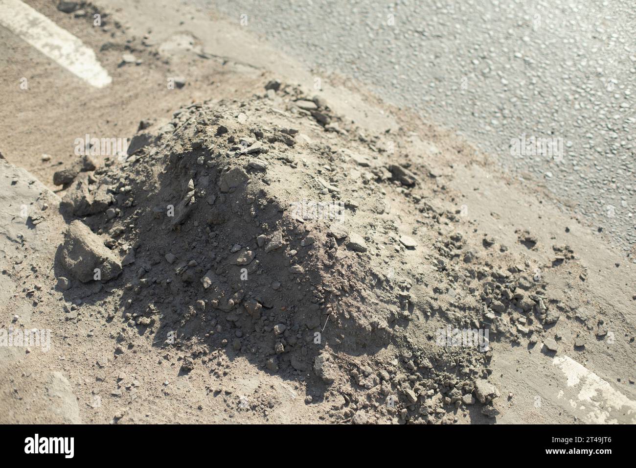 Dirt on road. Dust on side of road. Cleaning details. Lot of dirt. Pile ...