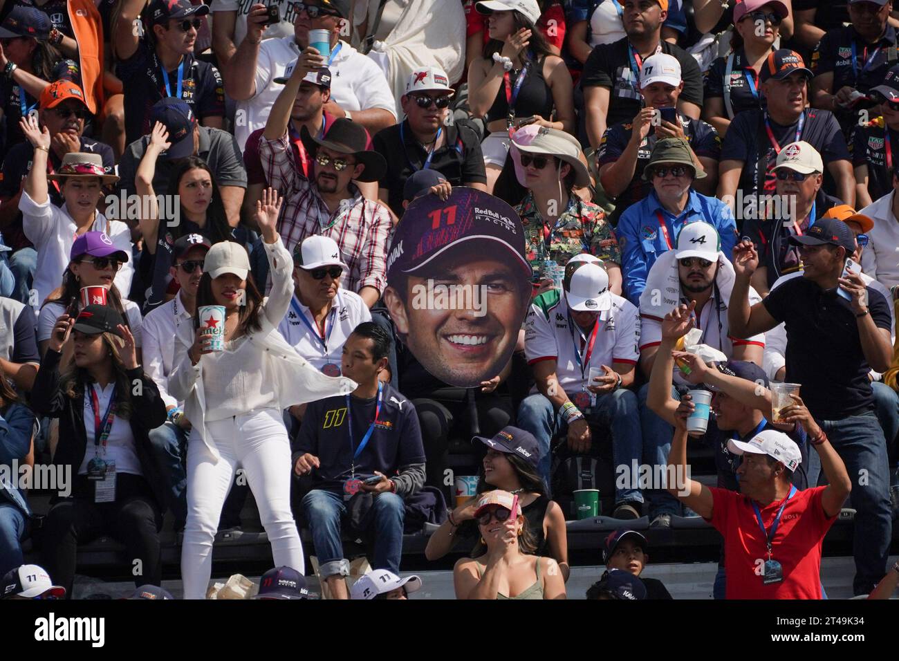 Fans cheer holding a picture of Red Bull driver Sergio Perez of Mexico ...