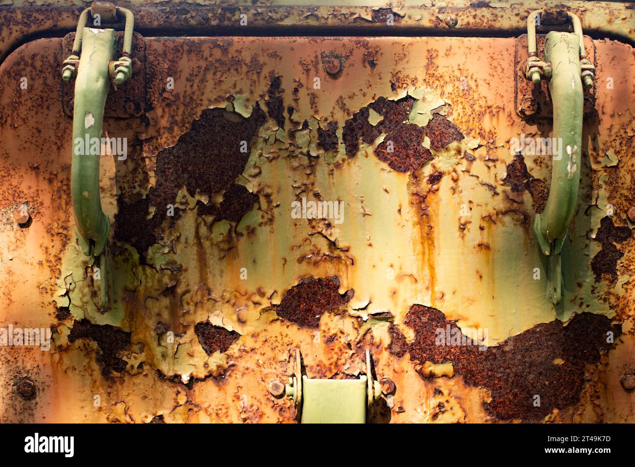 Rusty manhole cover. Fasteners on military equipment. Old door handles ...