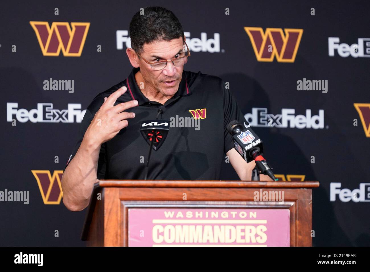 Washington Commanders head coach Ron Rivera speaks to members of the ...