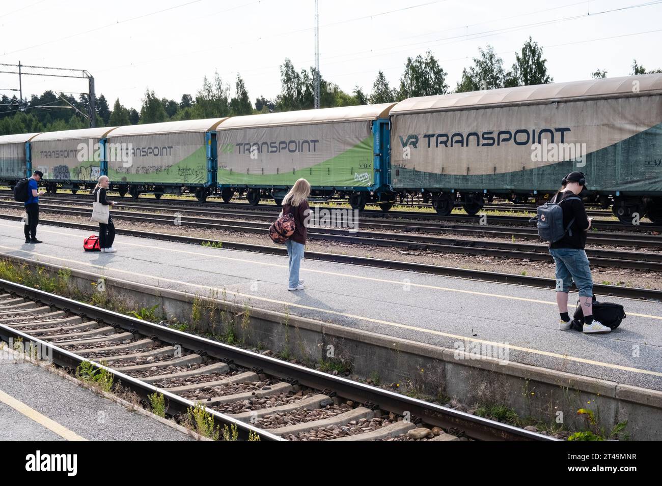 KAJAANI, RAILWAY STATION: A group of travellers wait for a VR Train at ...
