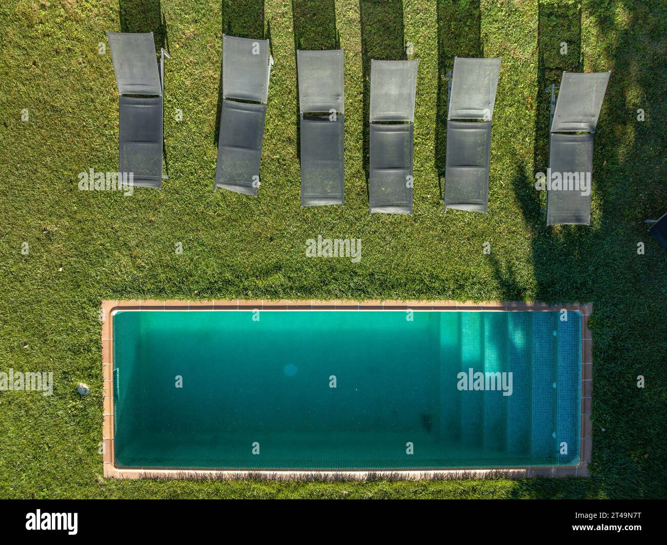 Aerial overhead view of the swimming pool of the Mas Cal Pubill rural ...