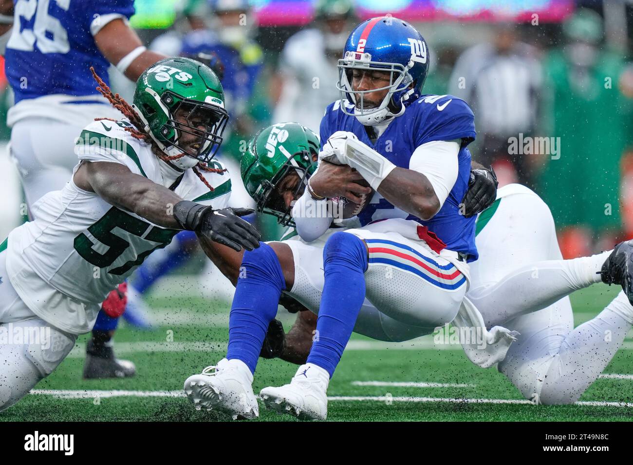 New York Giants quarterback Tyrod Taylor (2) is tackled on the run by ...