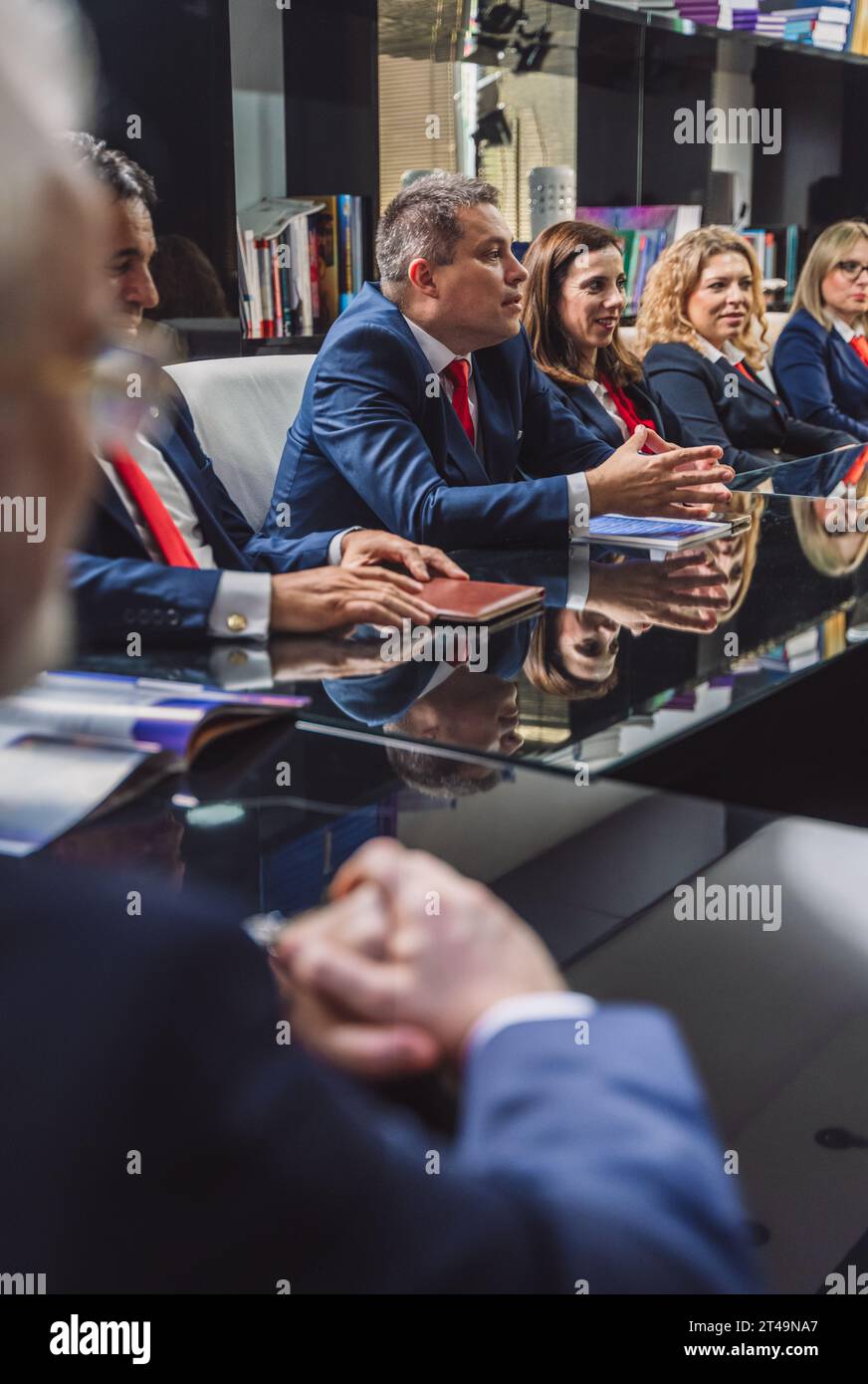 College teachers discussing during meeting at the office. Senior ...