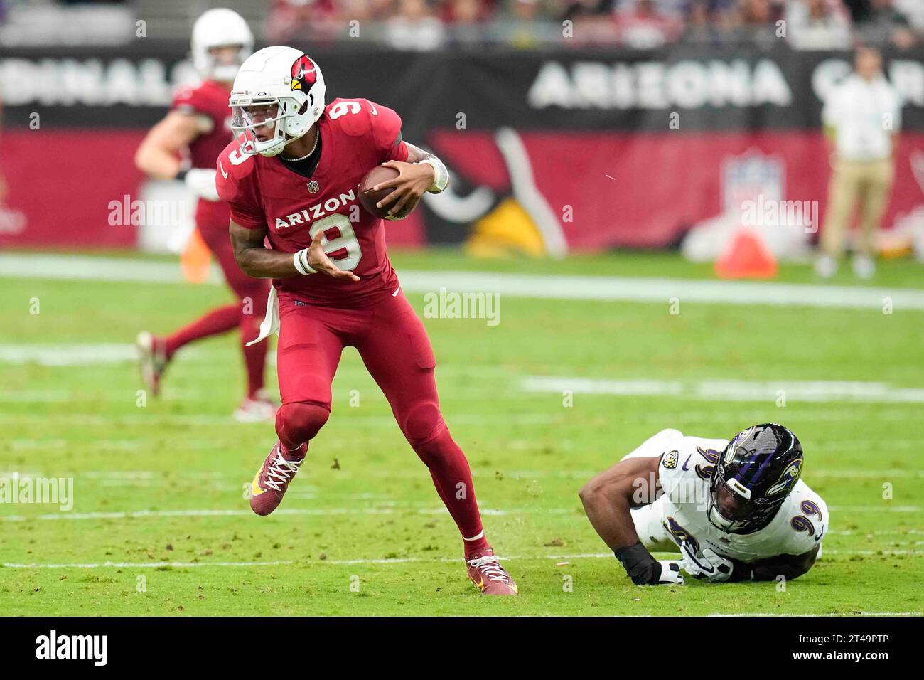 Arizona Cardinals quarterback Joshua Dobbs (9) evades a tackle from ...